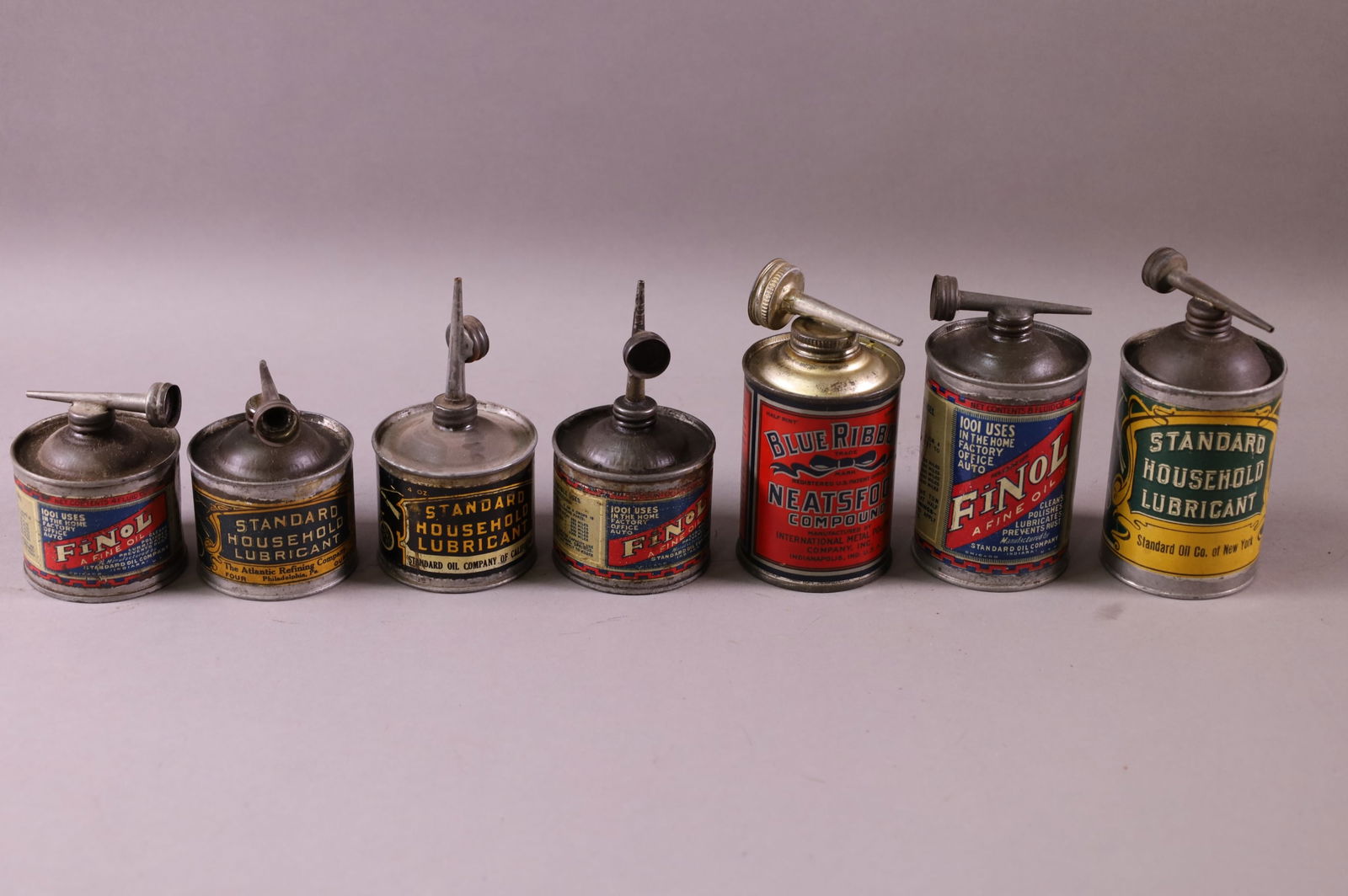 Seven Oiler Cans Auction