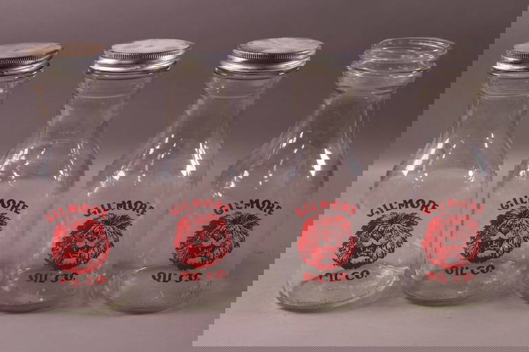 Four Reproduction Gilmore Oil Bottles