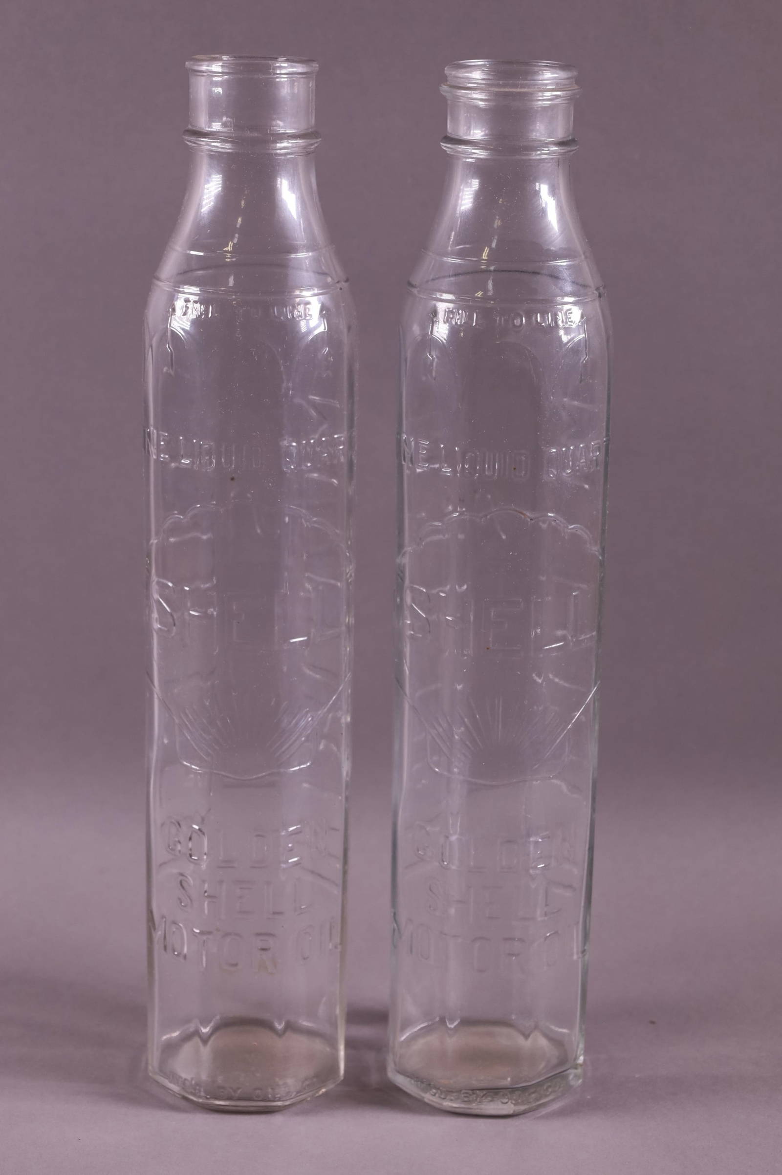 Two Golden Shell Oil Bottles Auction
