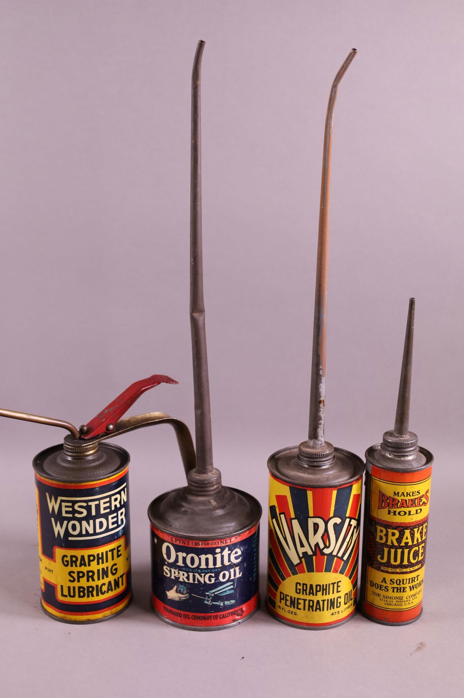 Four Lubricant Cans Auction