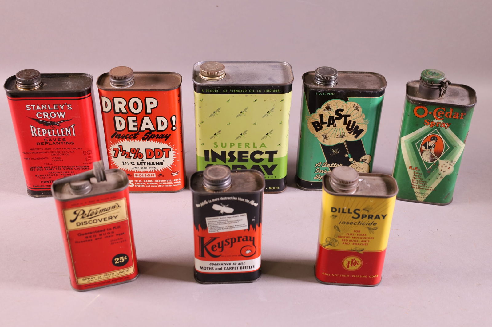 Eight Insecticide Cans Auction