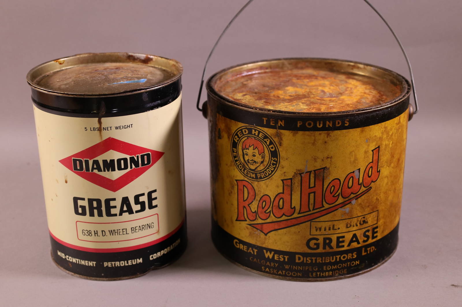 2 Grease Cans Auction