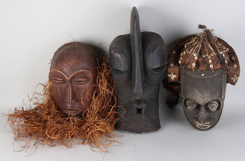 Three Old African Wood Stained Masks. Consisting Of: