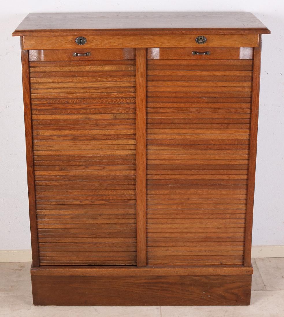 Antique oak double roller shutter filing cabinet. Circa