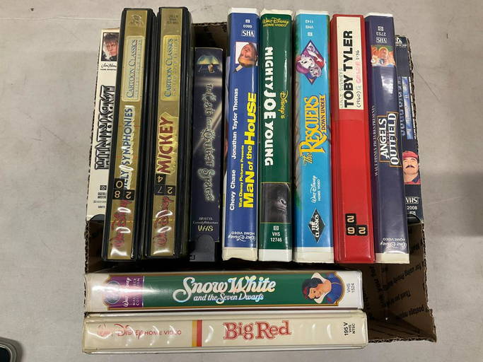 Lot of VHS tapes including Super Mario Bros, Snow White, The Rescuers ...