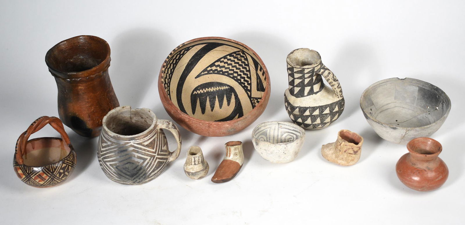 11 Prehistoric Native American Pottery Vessels.