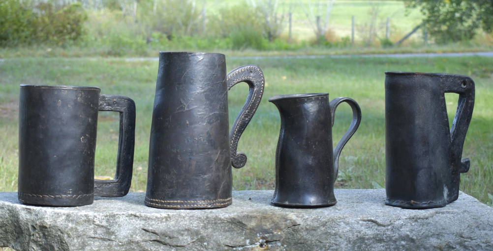 Four Early Leather Tankards.