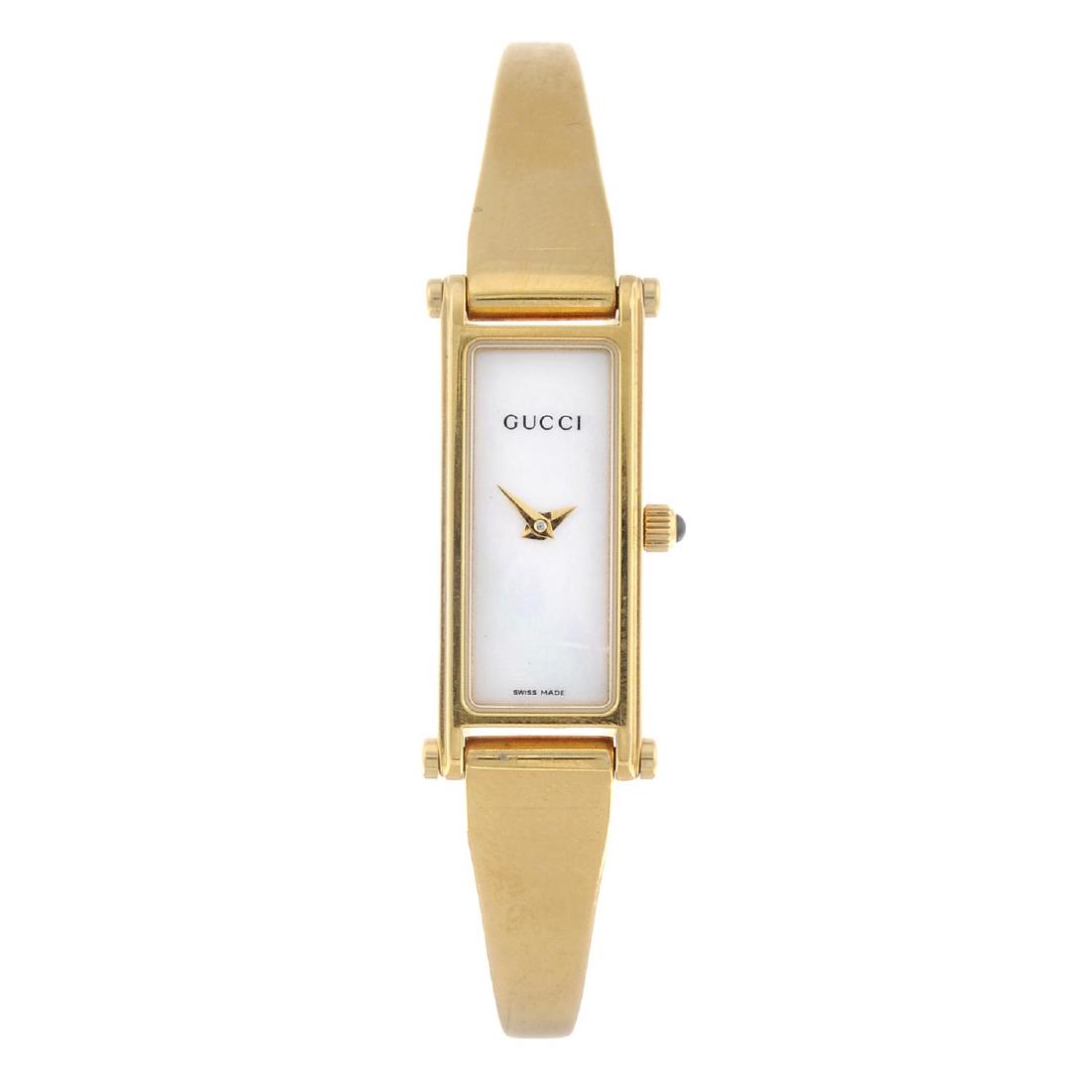 GUCCI - a lady's 1500L bracelet watch. Gold plated