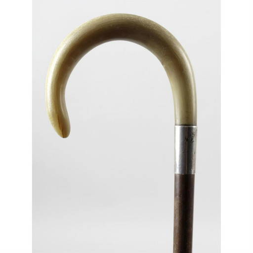 A World War I carved wooden walking cane, together with six further ...