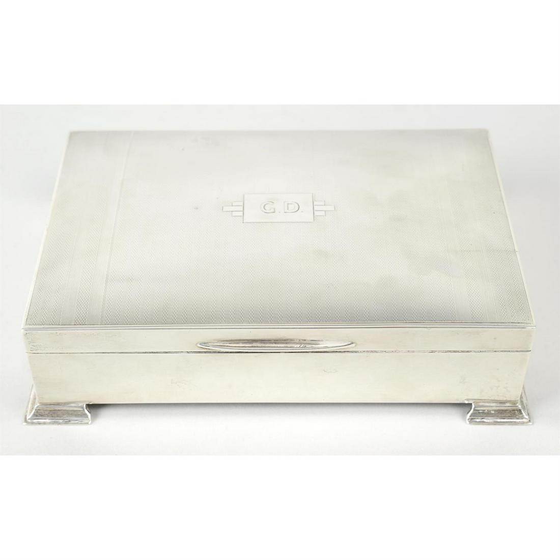 A Mid-20th Century Silver Mounted Table Cigarette Box. Auction