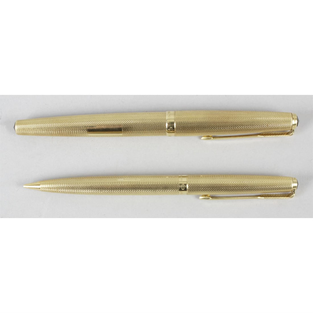 A Set Of 18ct Gold Parker Pens. Auction
