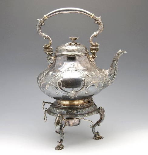 A Silver Plated Spirit Kettle And Stand.