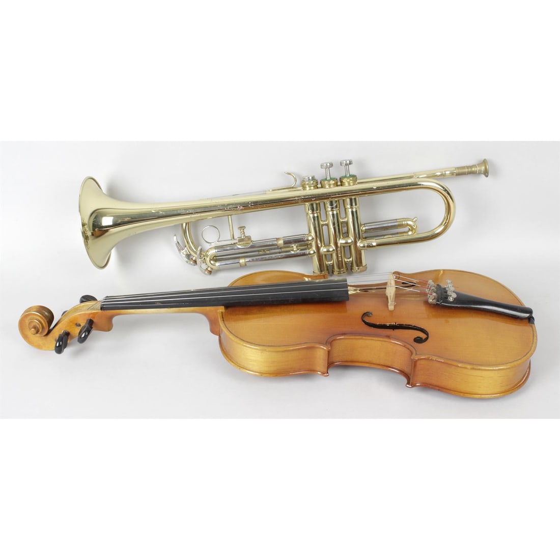 A Violin, A Trumpet And Two Mantel Clocks. Auction