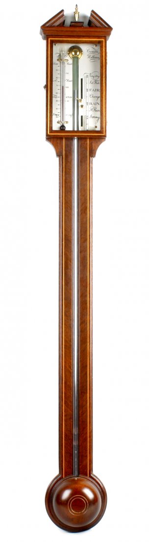 A reproduction mahogany stick barometer