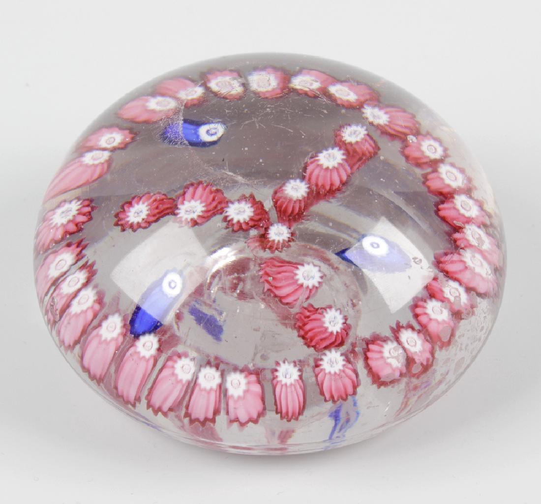 A low domed Old English paperweight, having pink and