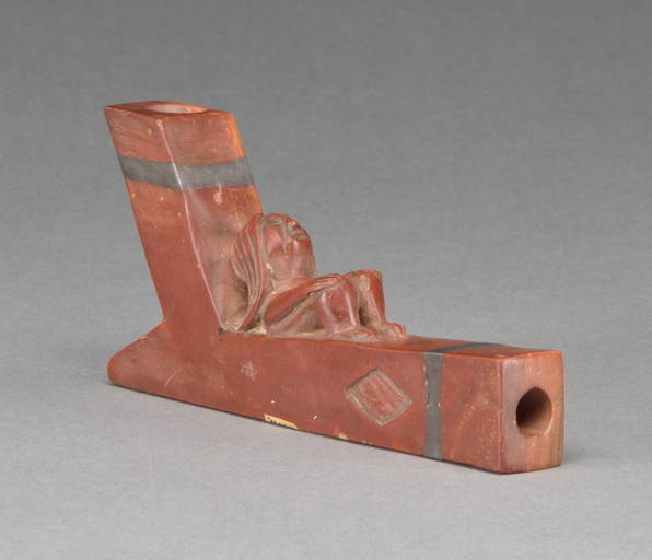 Catlinite Pipe With Reclining Human Figure.