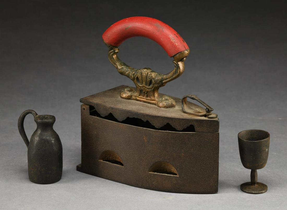 Two Cast Metal Objects Together With Auction
