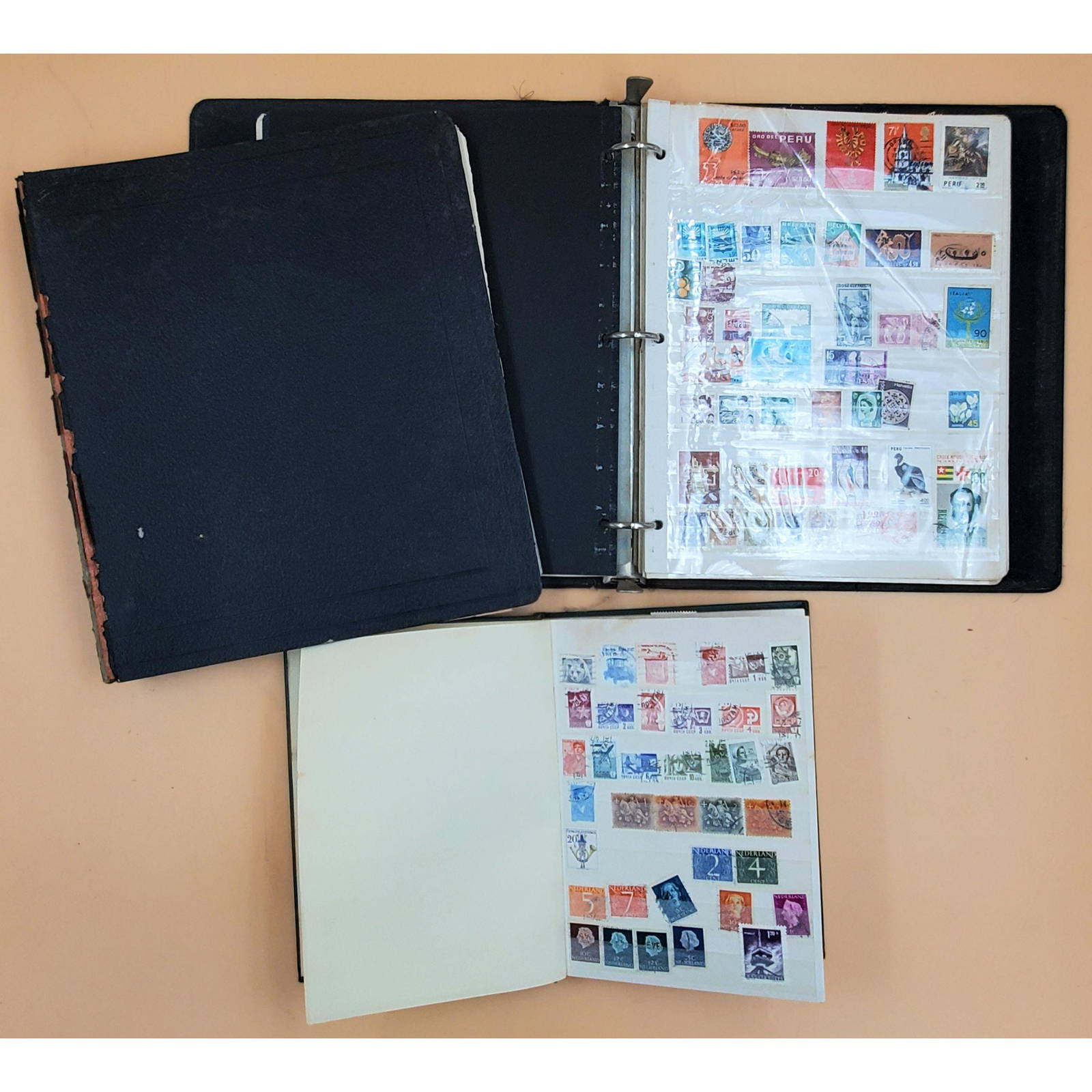 3 Stock Folders Of About 900 Stamps Auction