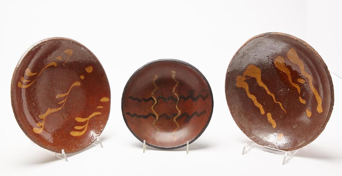 Three Early Pennsylvania Redware Slipware Plates