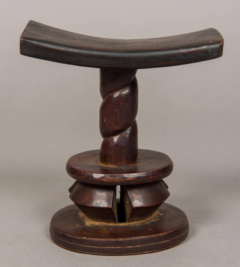 An African tribal carved wooden headrest With curved