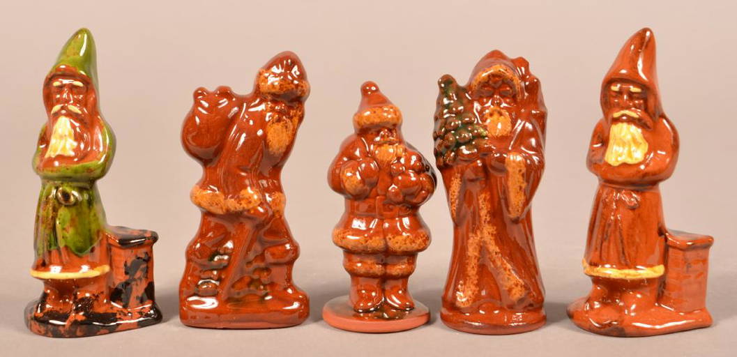 Five Small Foltz Redware Molded Santa Figures.