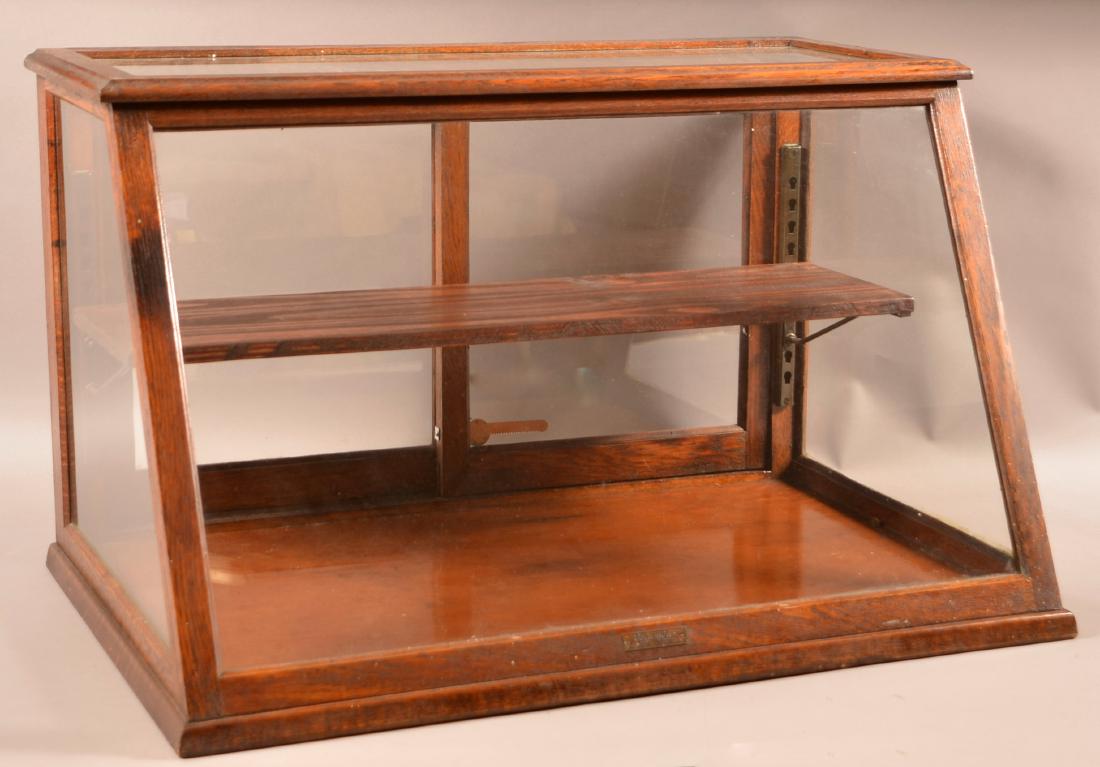 Columbus Oak Slant-front Counter Display.