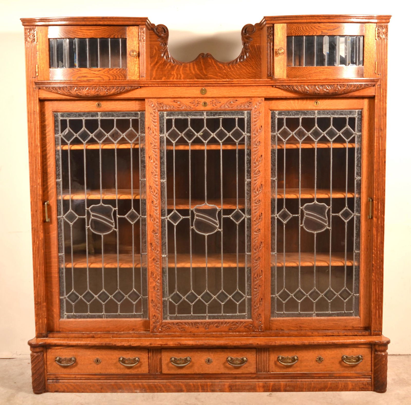 Antique American Oak Leaded Glass Triple Bookcase.