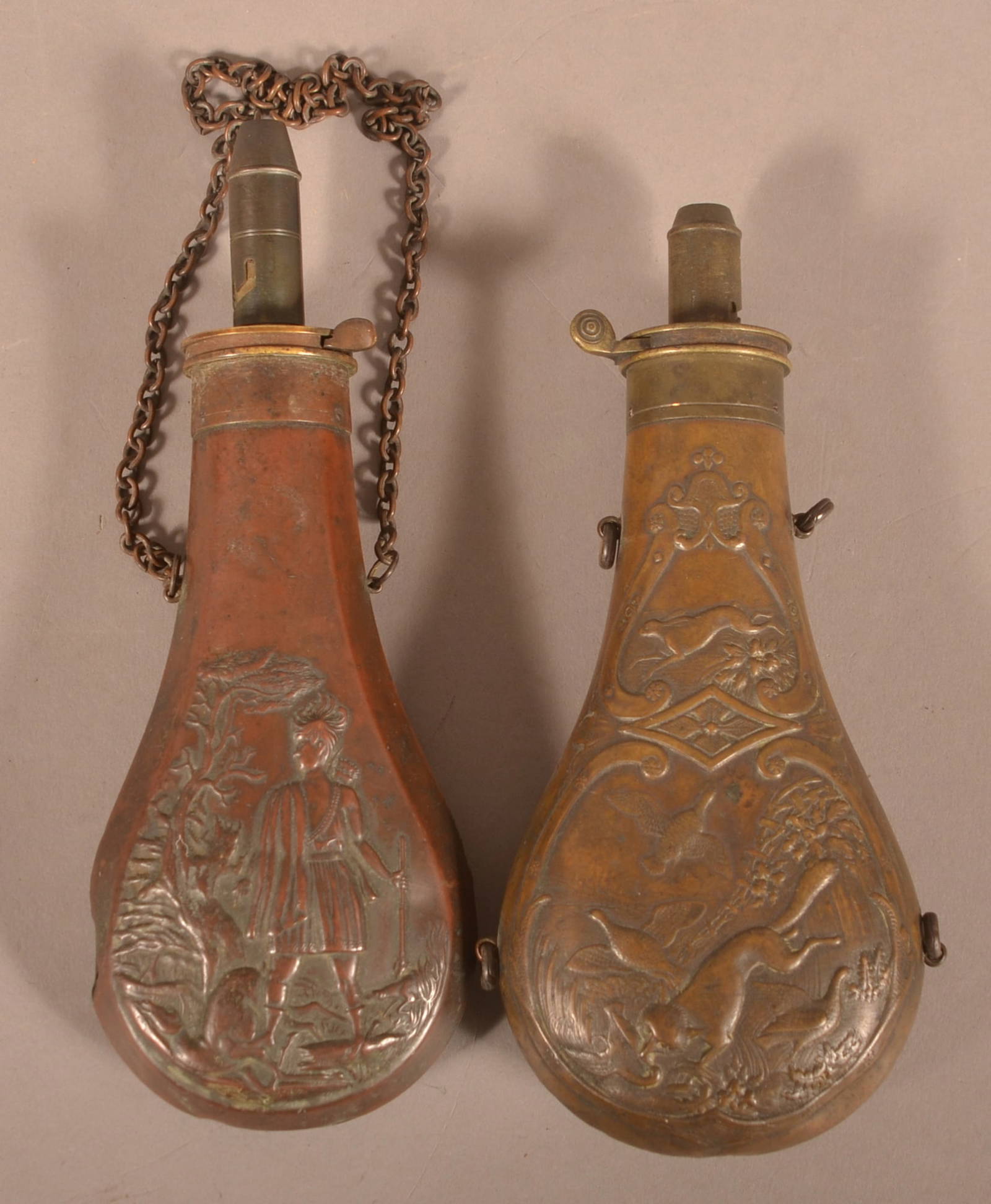 Two Antique Copper/brass Embossed Powder Flasks. Auction