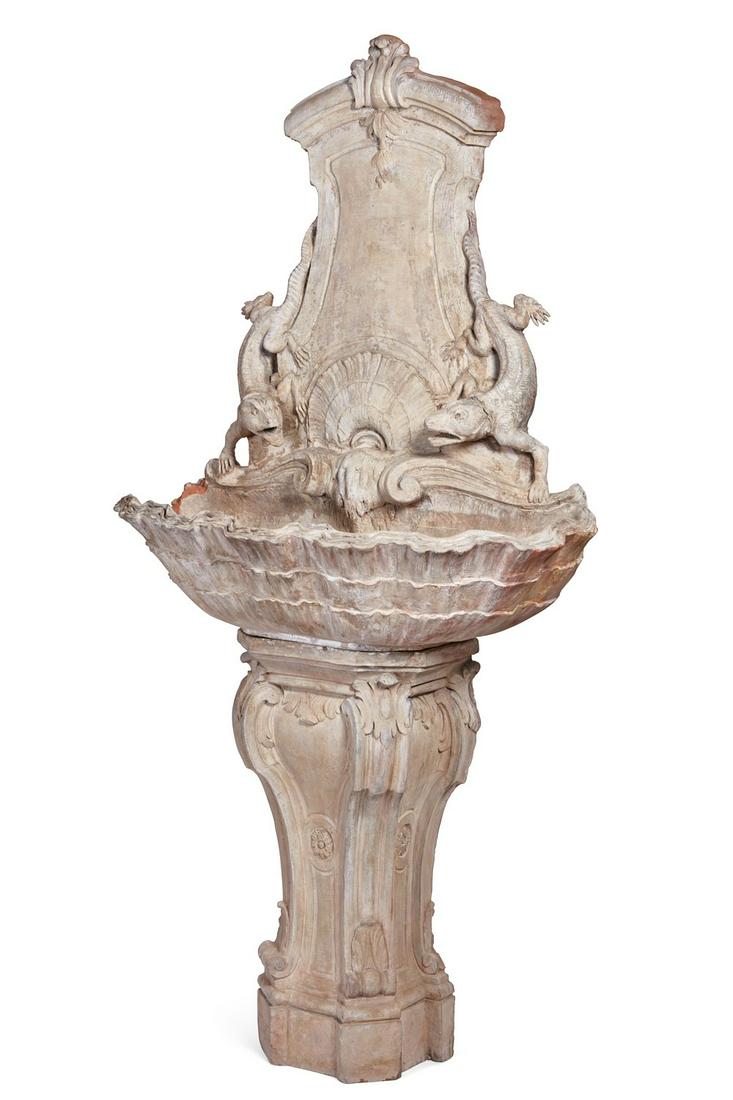 A Baroque Style Tinted Terracotta Wall Fountain