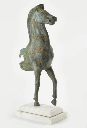 A Verdigris Bronze Model Of A Striding Horse