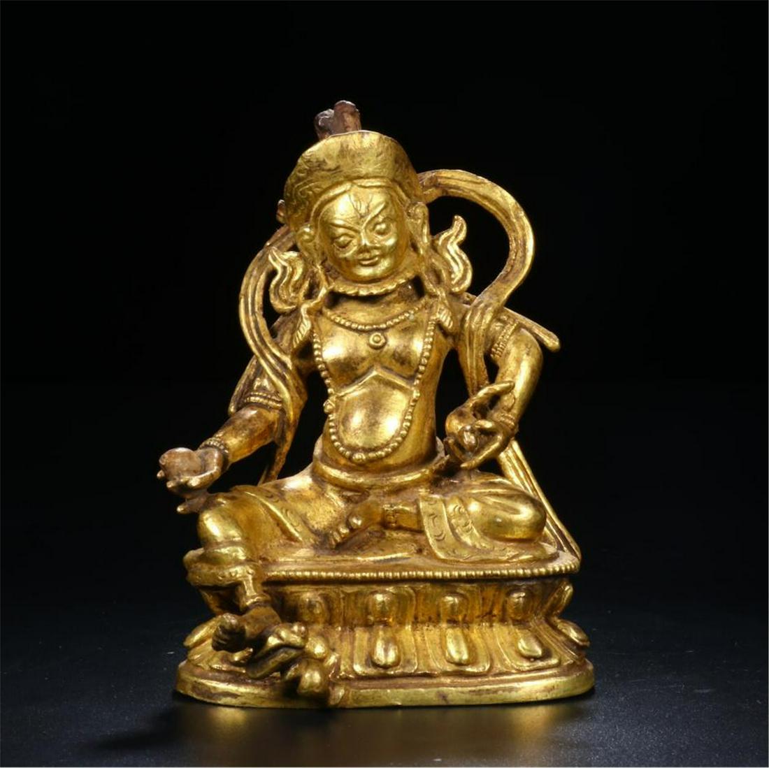 Tibetan Gilt Bronze Seated Yellow Jambhala