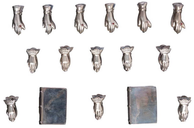 Silver Hand Clasps And Books