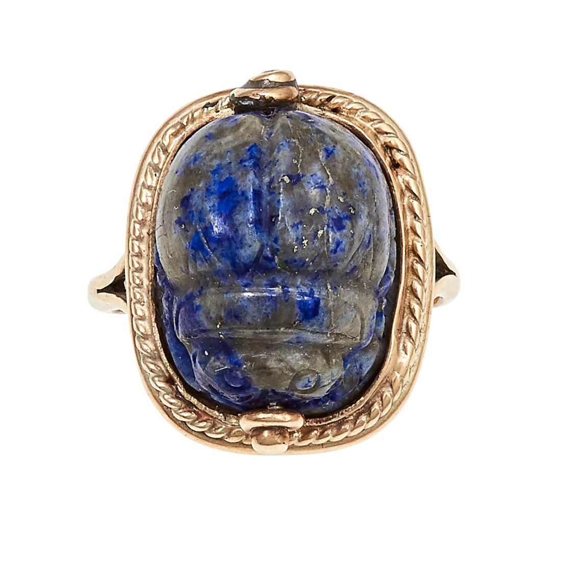 AN ANTIQUE CARVED LAPIS LAZULI SCARAB RING in yellow
