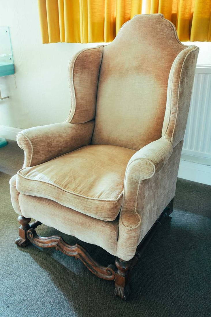 A William & Mary Style Upholstered Wingback Fireside Chair With A High ...