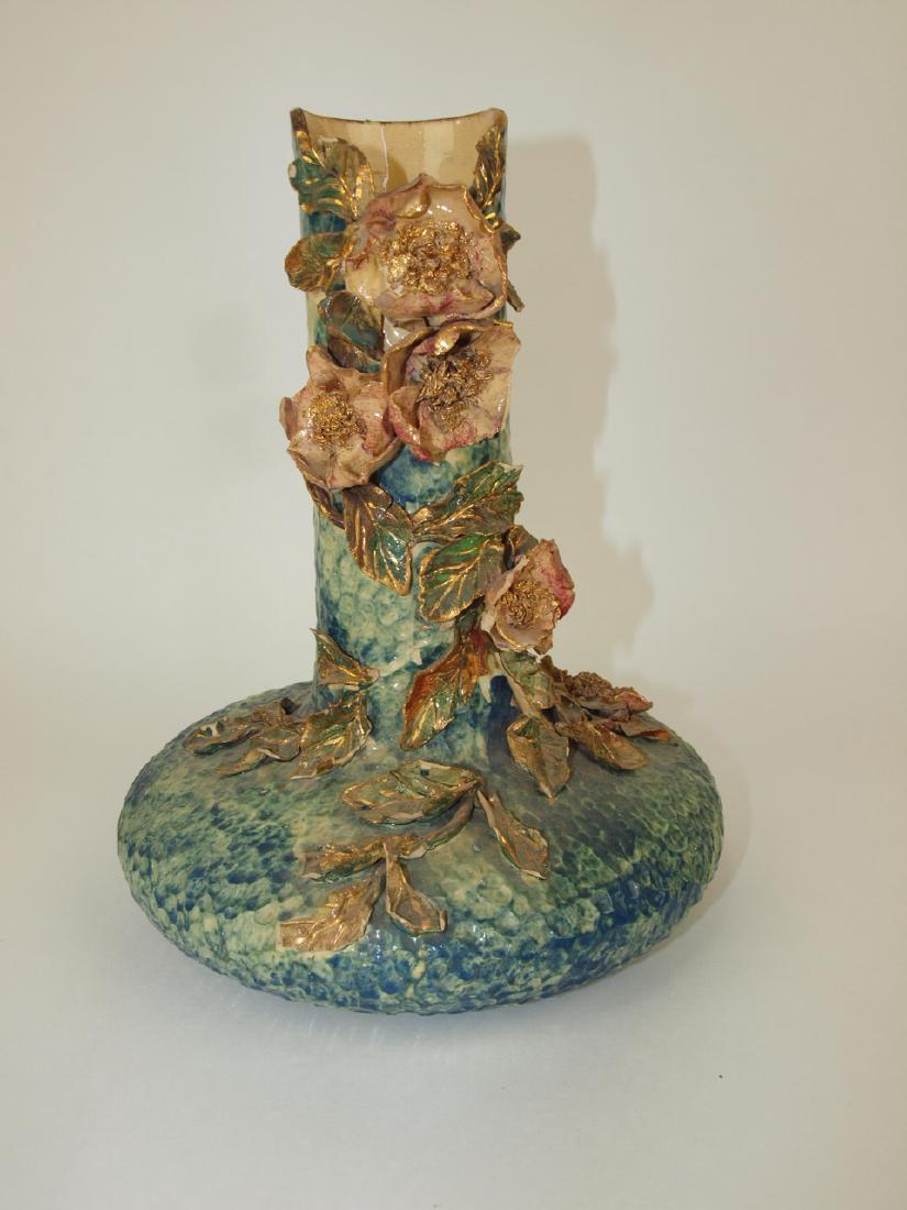 Pauline art pottery vase with flowers and leaves, some