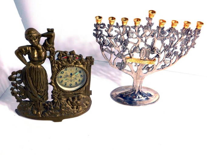 Menorah And A Brass Clock With A Figure