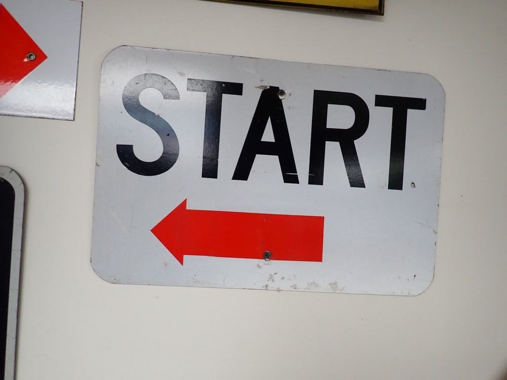 "start With Arrow" Metal Sign Auction