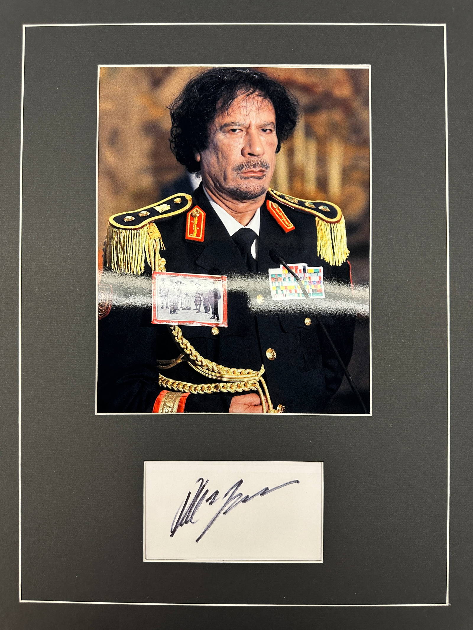 Muammar Gaddafi Autographed Display Auction