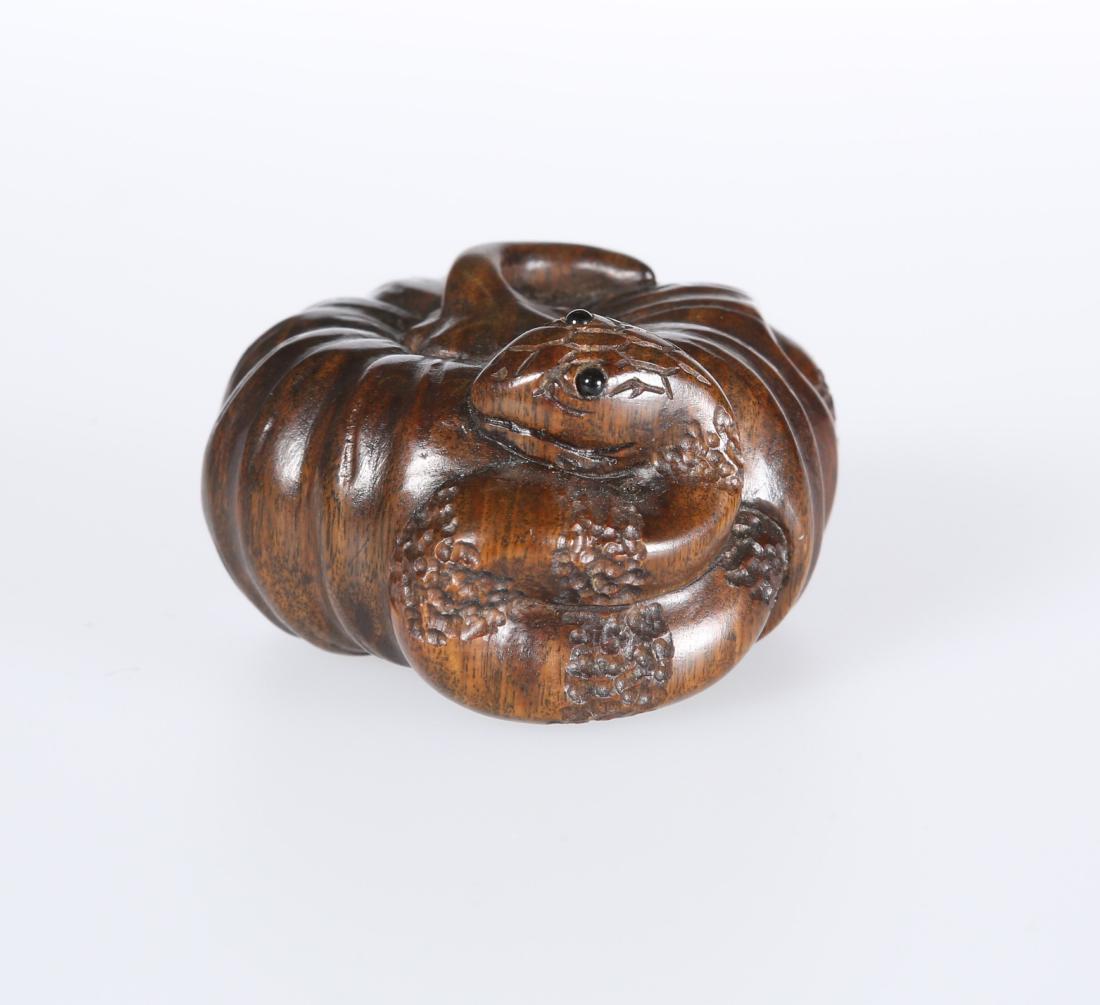 A JAPANESE CARVED WOODEN NETSUKE, carved as pumpkin and - Mar 24, 2019 ...