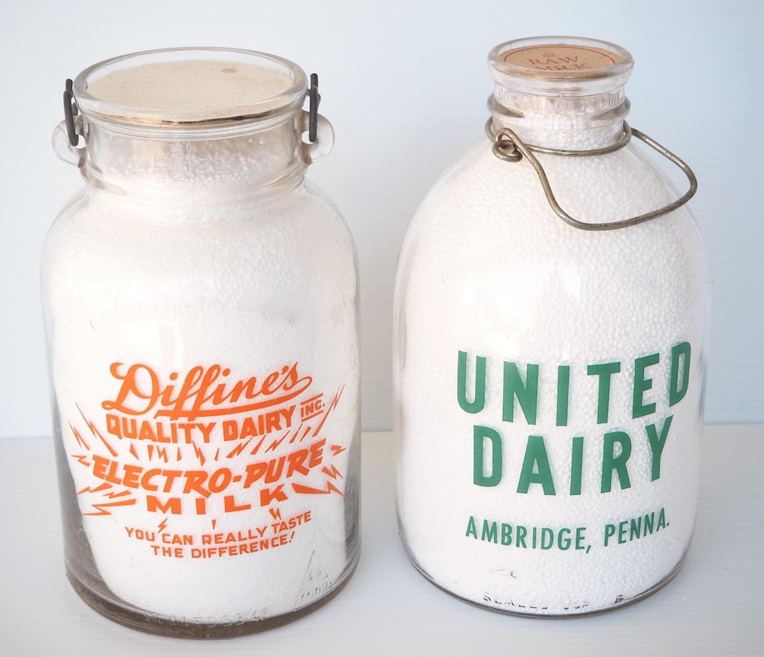 (2) 1 Gallon Milk Bottles Auction