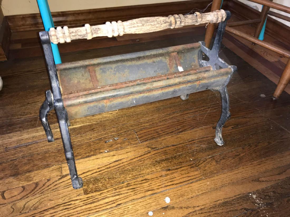 Log roller used to make logs from newspaper ca 1900.