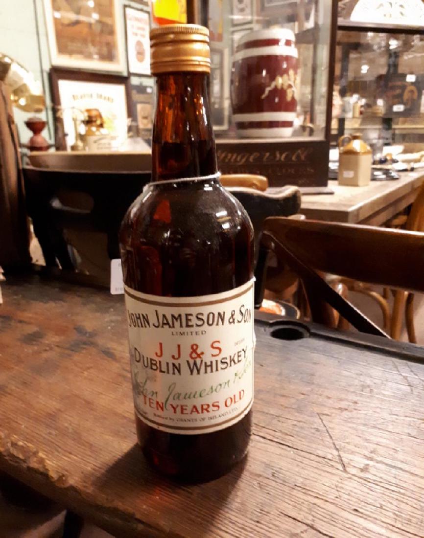 1950's bottle of John Jameson Whiskey with copper top.