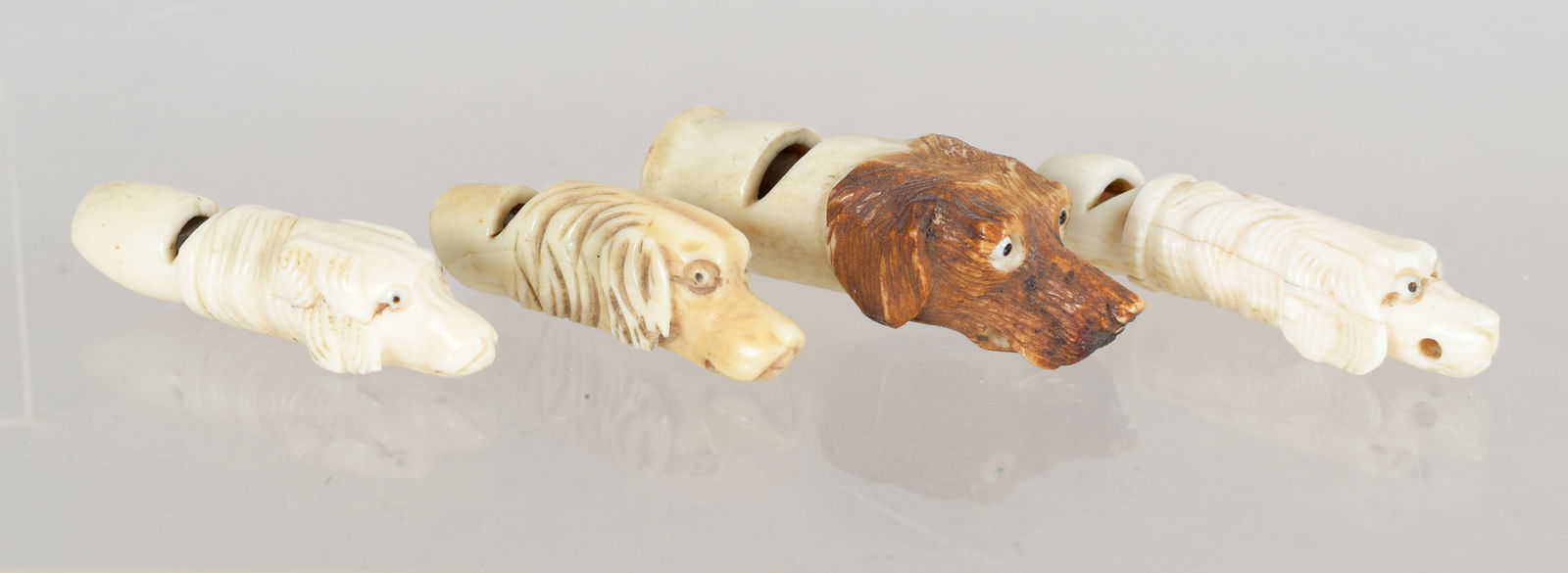 Four Dog Head Carved Antique Whistles Auction