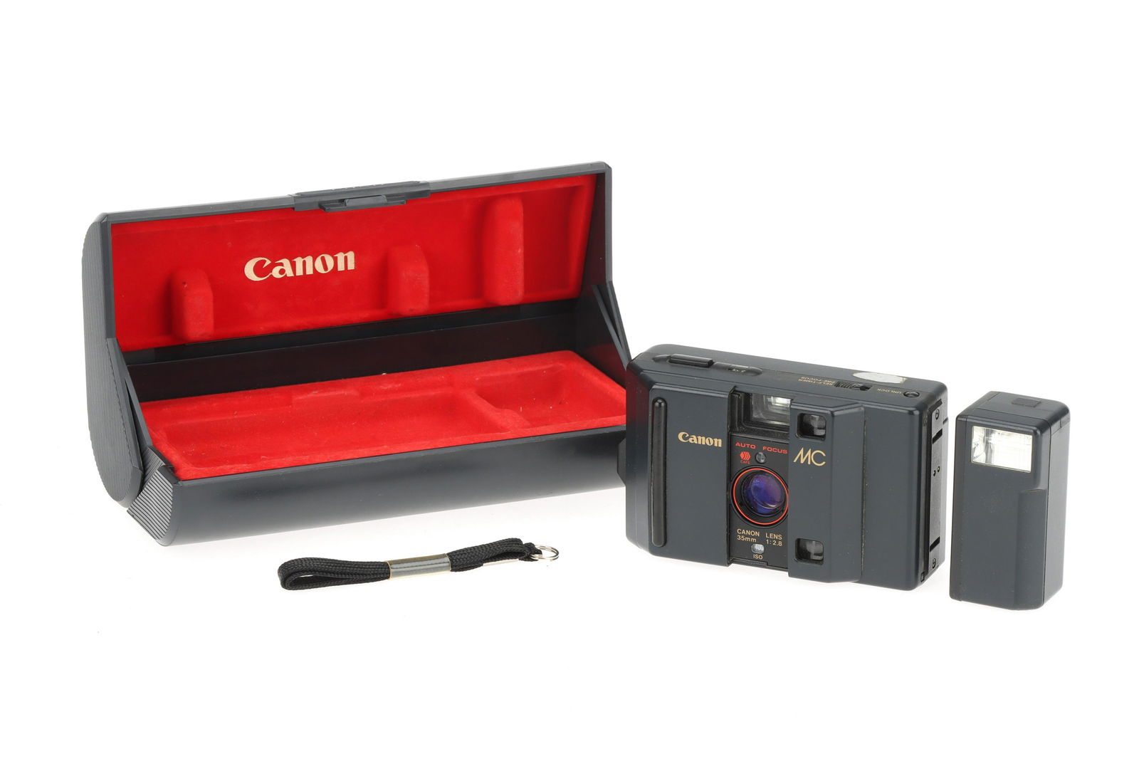 A Canon Mc 35mm Compact Camera,