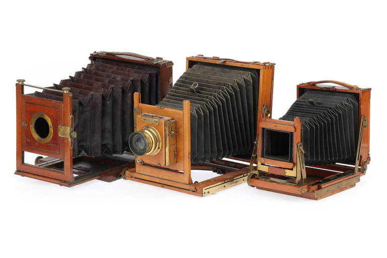 Three Mahogany & Brass Large Format Field Cameras,