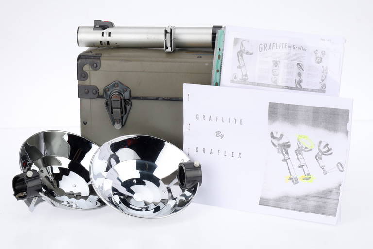 A Graflex Graflite Flash Gun And Case,