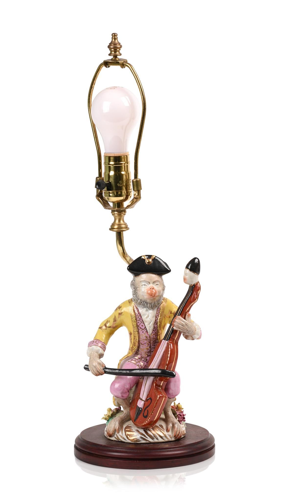Porcelain Figural Lamp With Monkey Playing A Cello. Auction