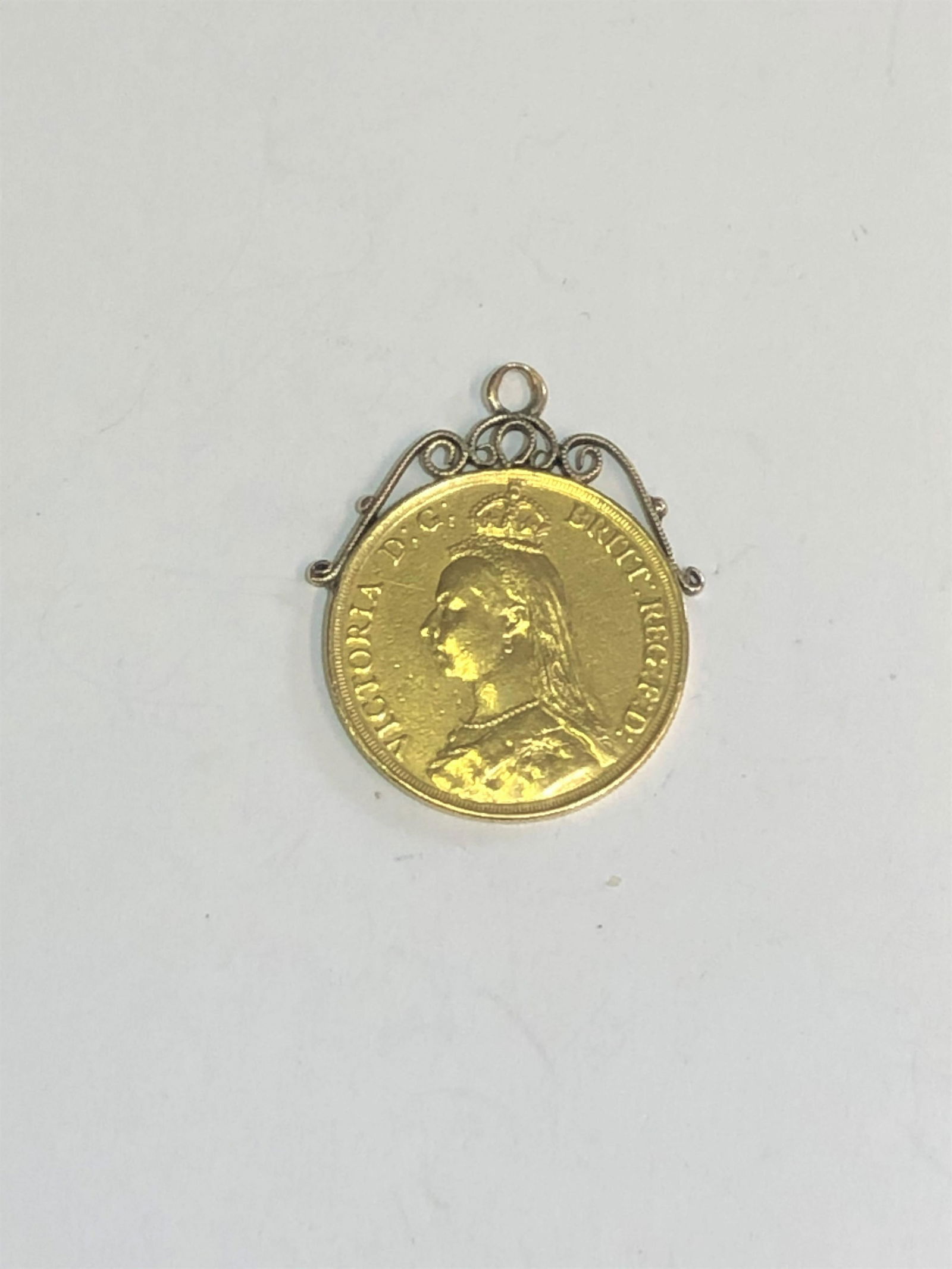 A Victorian 1887 Two Pound Gold Coin With Scroll Mount