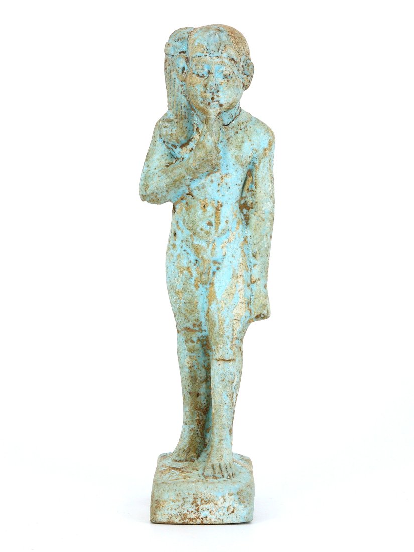 An Egyptian Figurine Of Harpocrates, The God Of Silence Auction