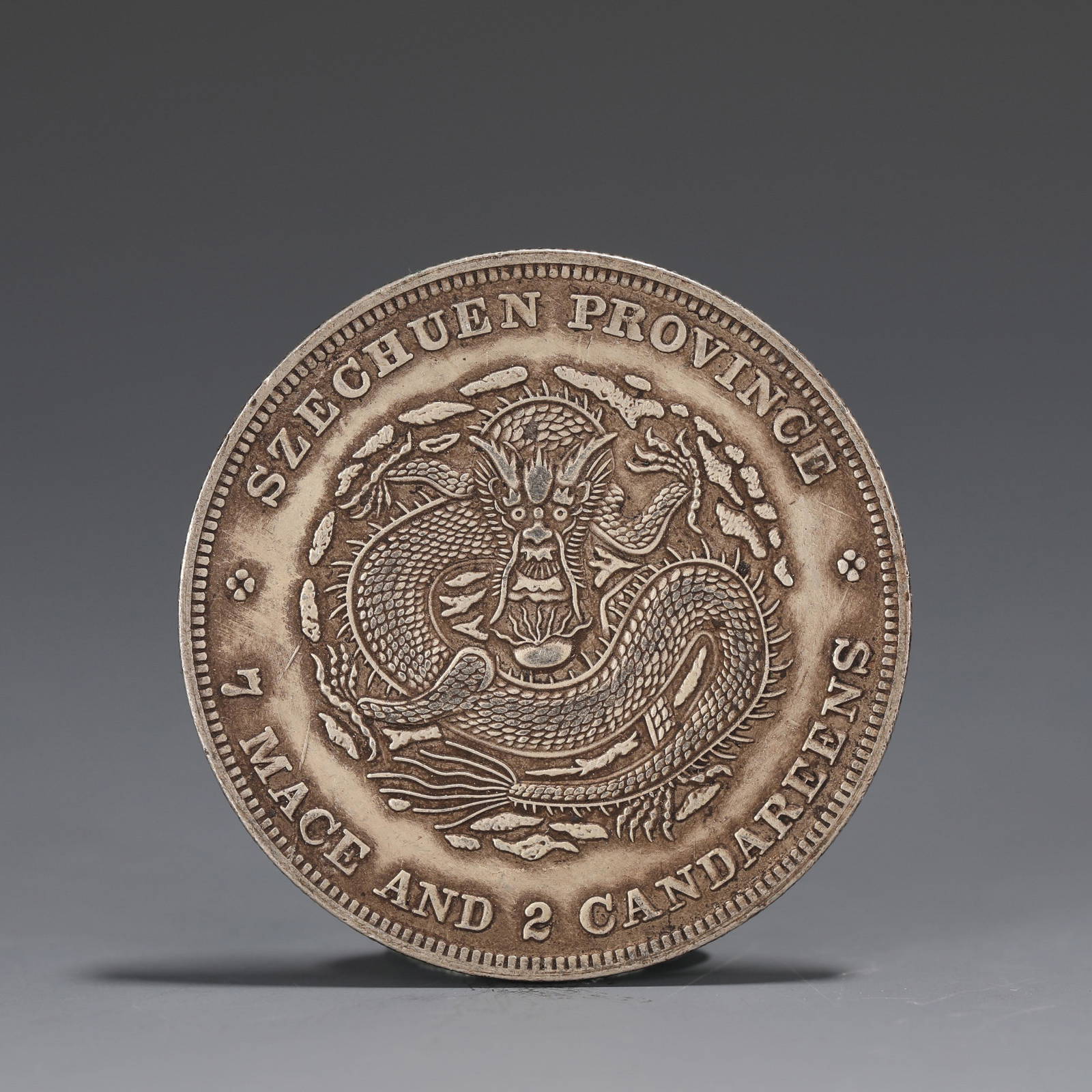 A Chinese Silver Dragon Coin Auction